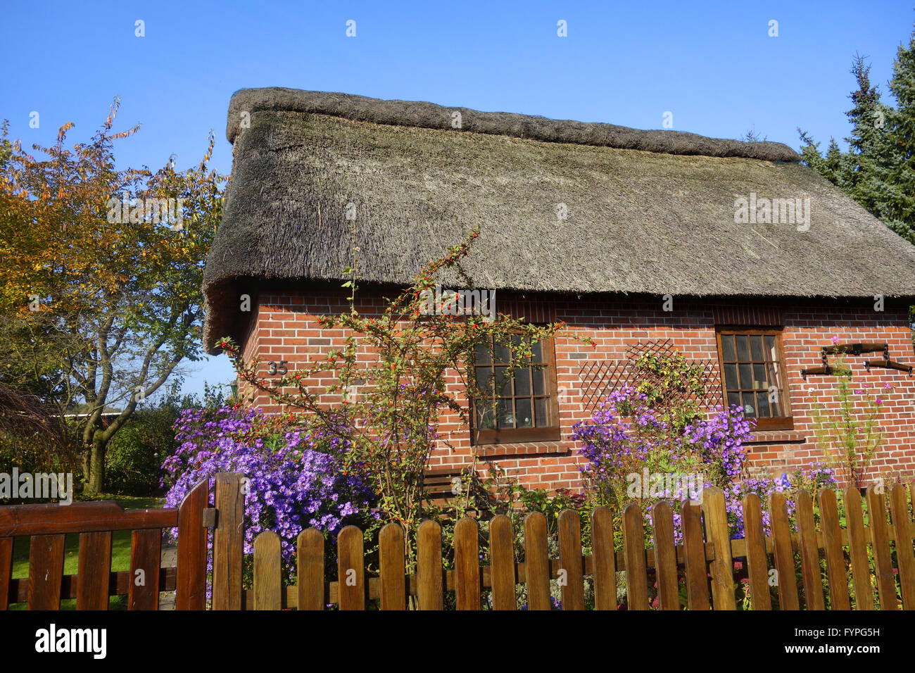 Old thatched cottage in small hi-res stock photography and images - Alamy