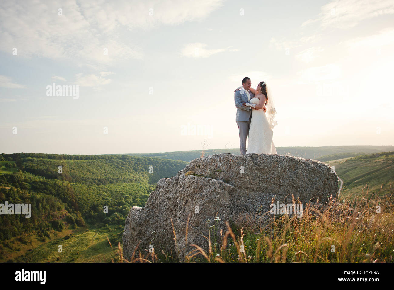 wedding couple on the rock Stock Photo - Alamy