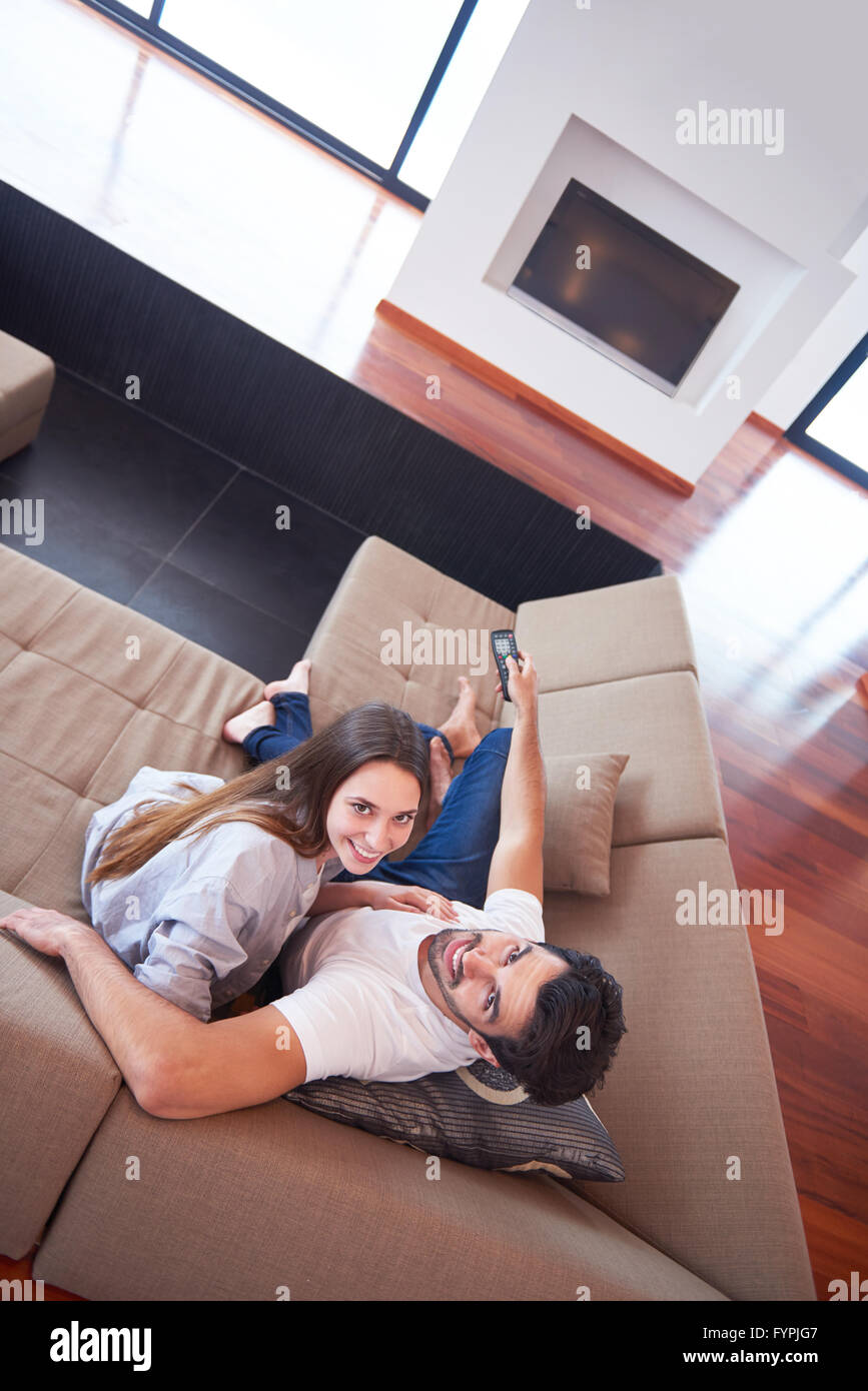 young couple watching tv at home Stock Photo - Alamy