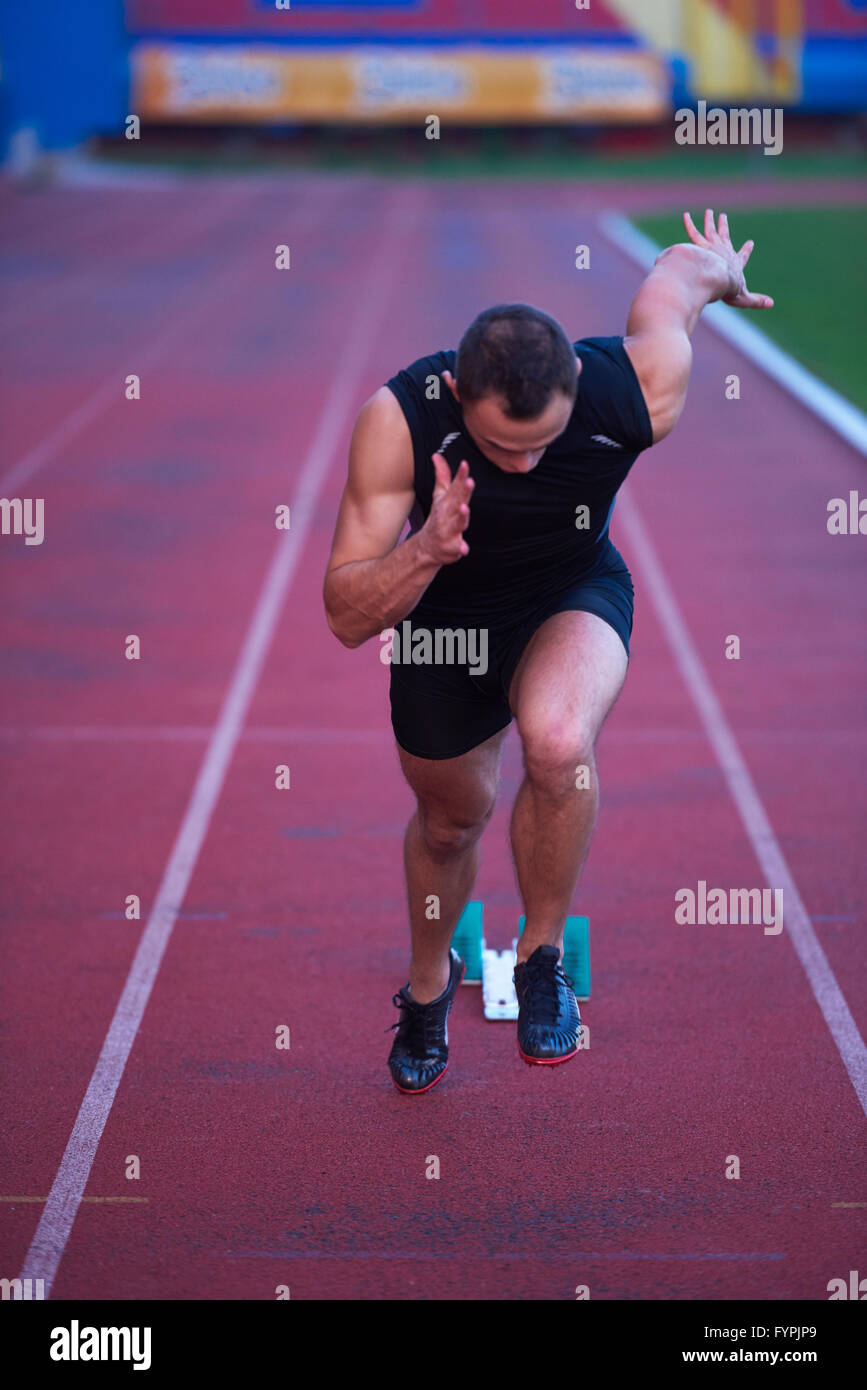 Athletic man start Stock Photo - Alamy