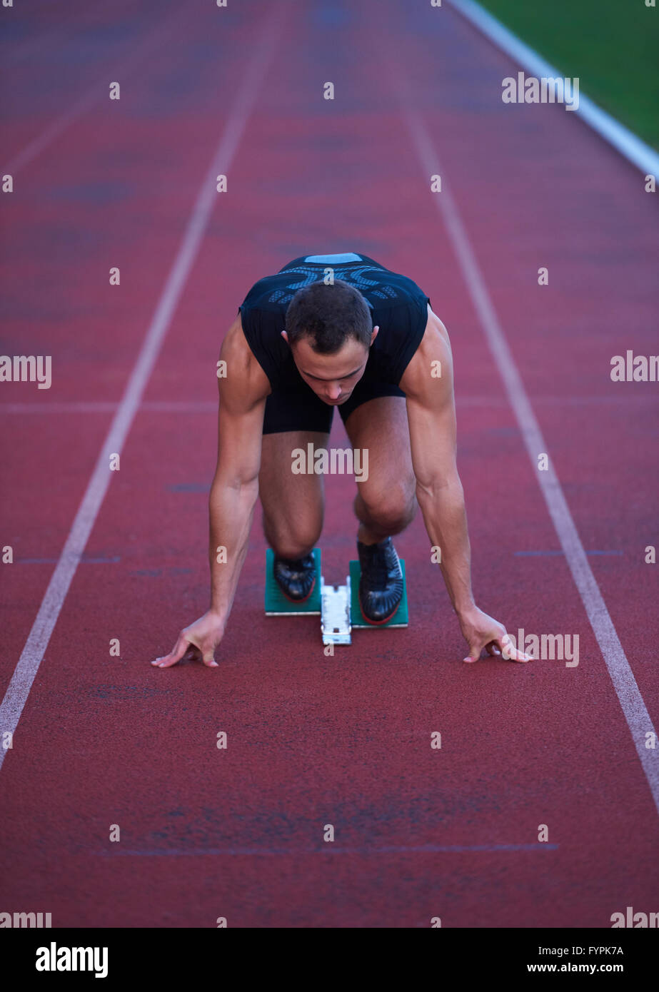Athletic man start Stock Photo - Alamy