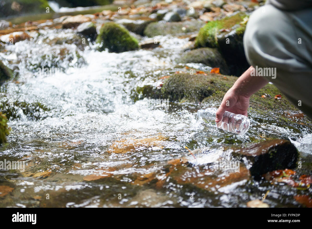 man drinking fresh water from spring Stock Photo - Alamy