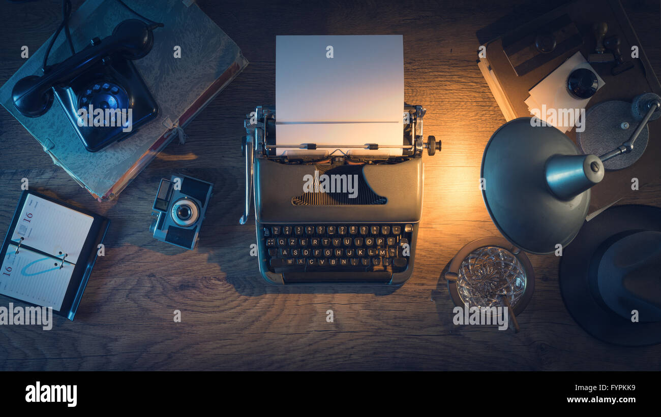 Retro journalist's desk 1950s style with vintage typewriter, phone and ...