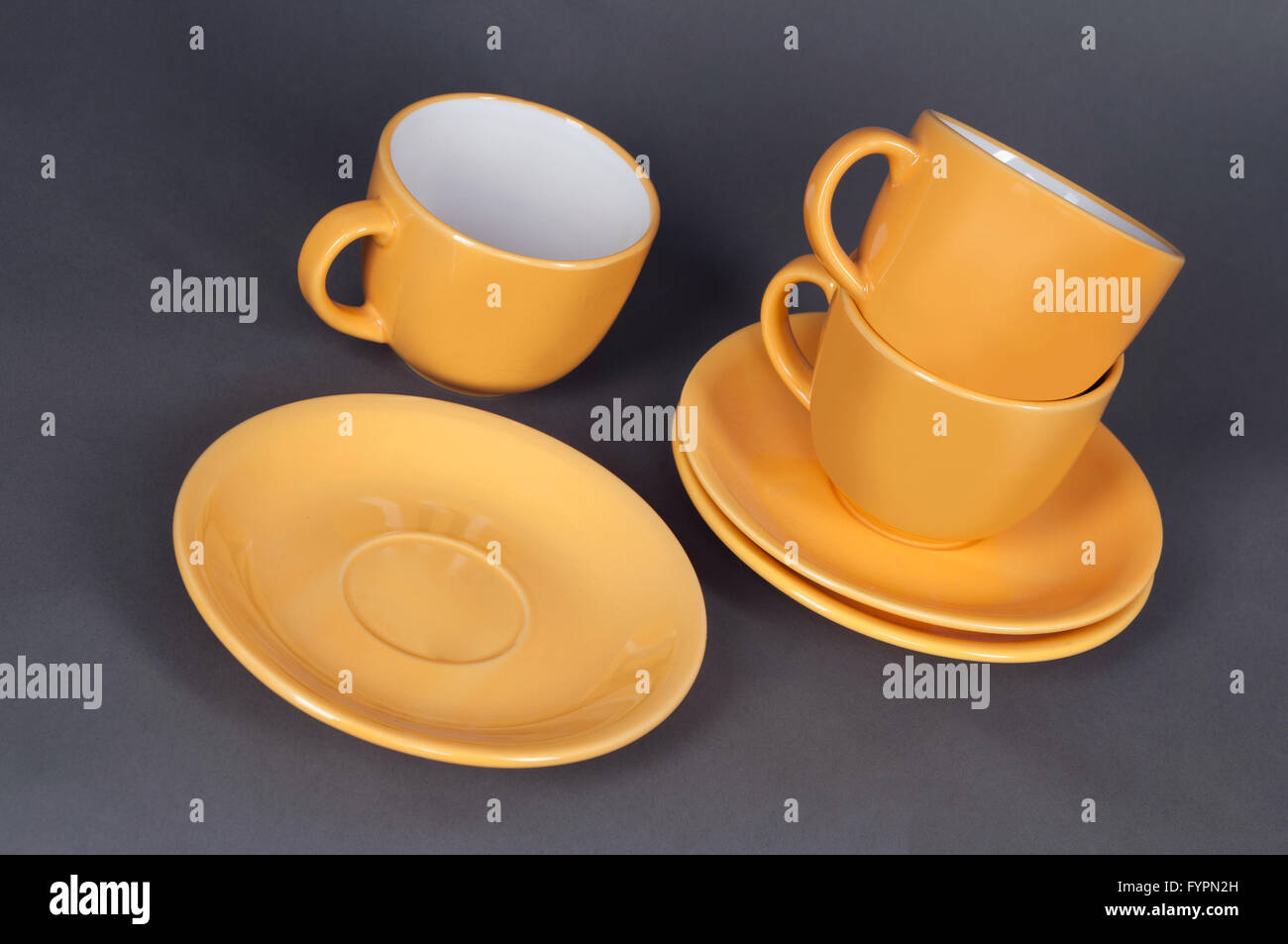 orange cup and saucer Stock Photo - Alamy