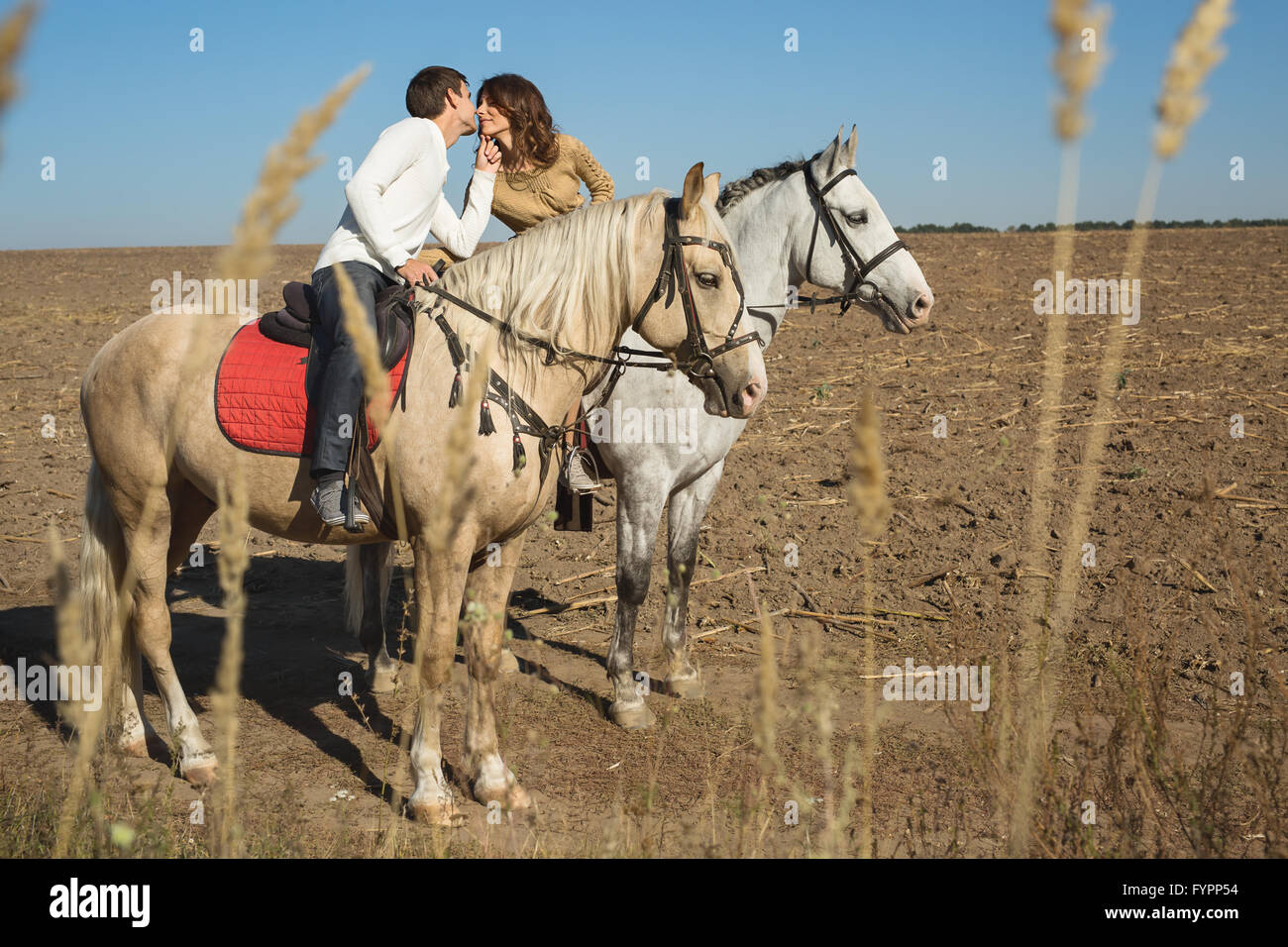 Couple horse riding romantic hi-res stock photography and images - Alamy