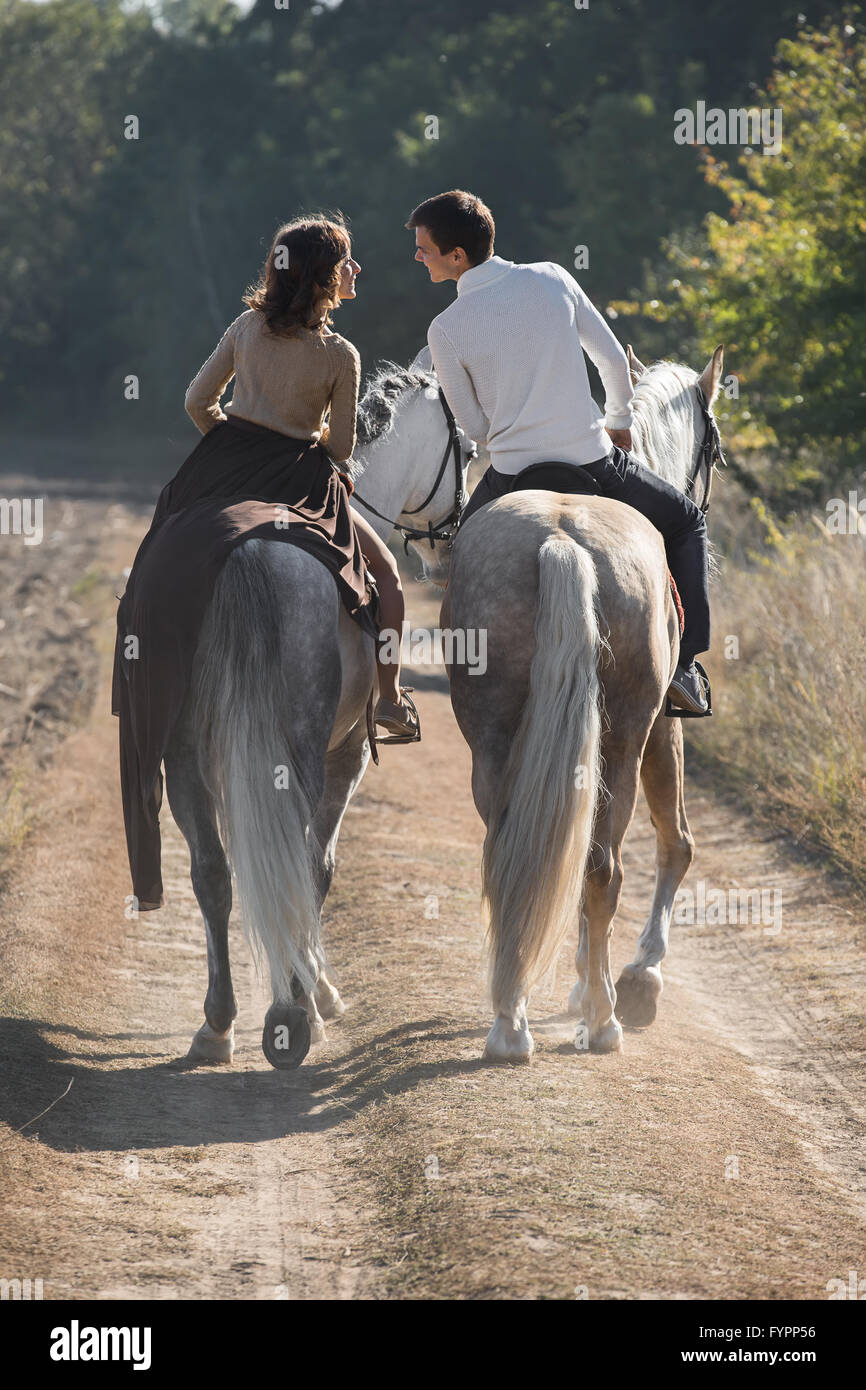 Romantic couple riding Stock Photo - Alamy