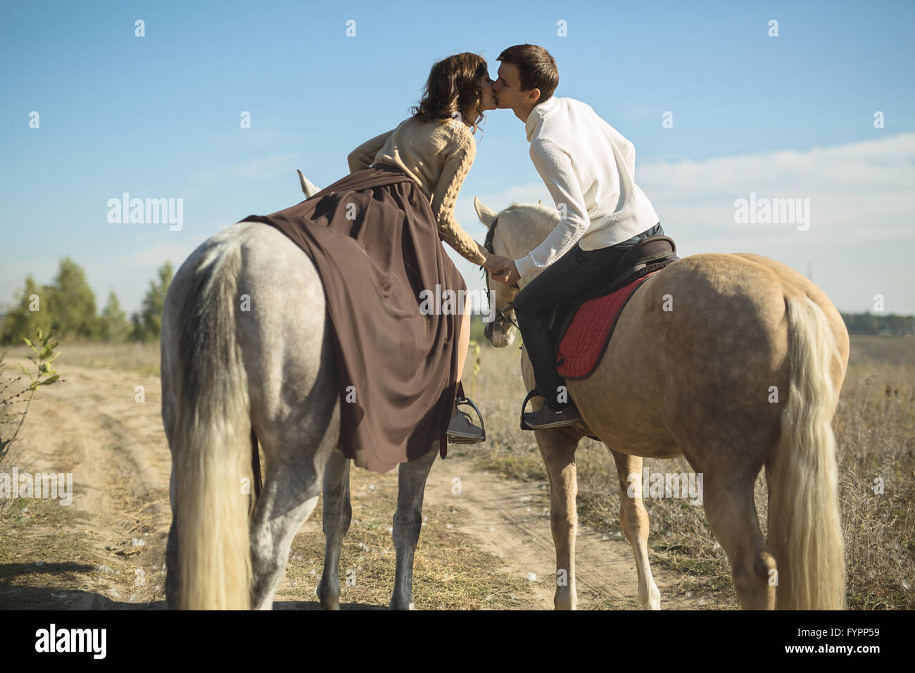 Romantic couple riding Stock Photo - Alamy