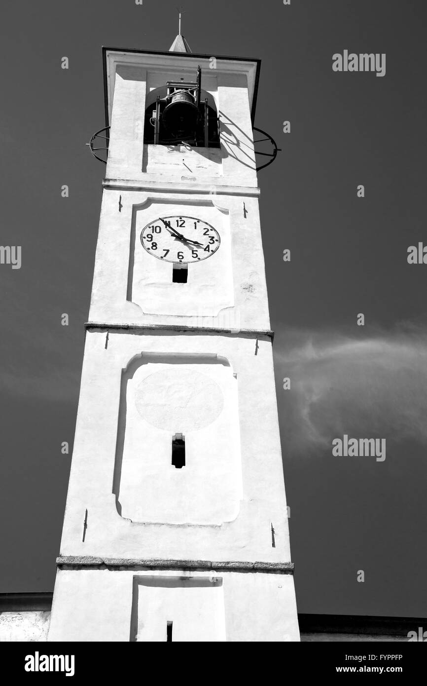 monument clock tower in italy europe old stone and bell Stock Photo - Alamy