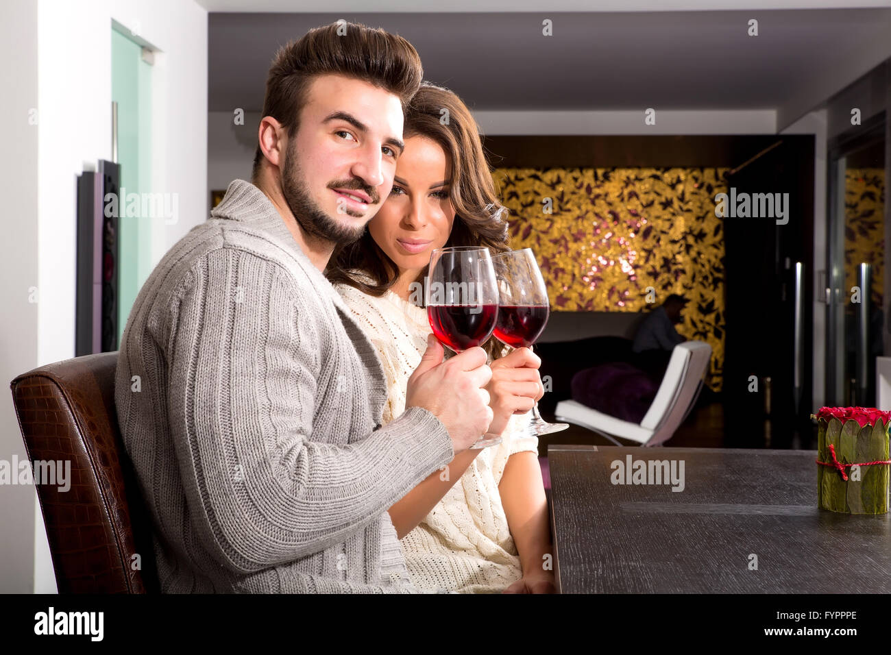 Young couple having a romantic evening with a glass of wine Stock Photo ...