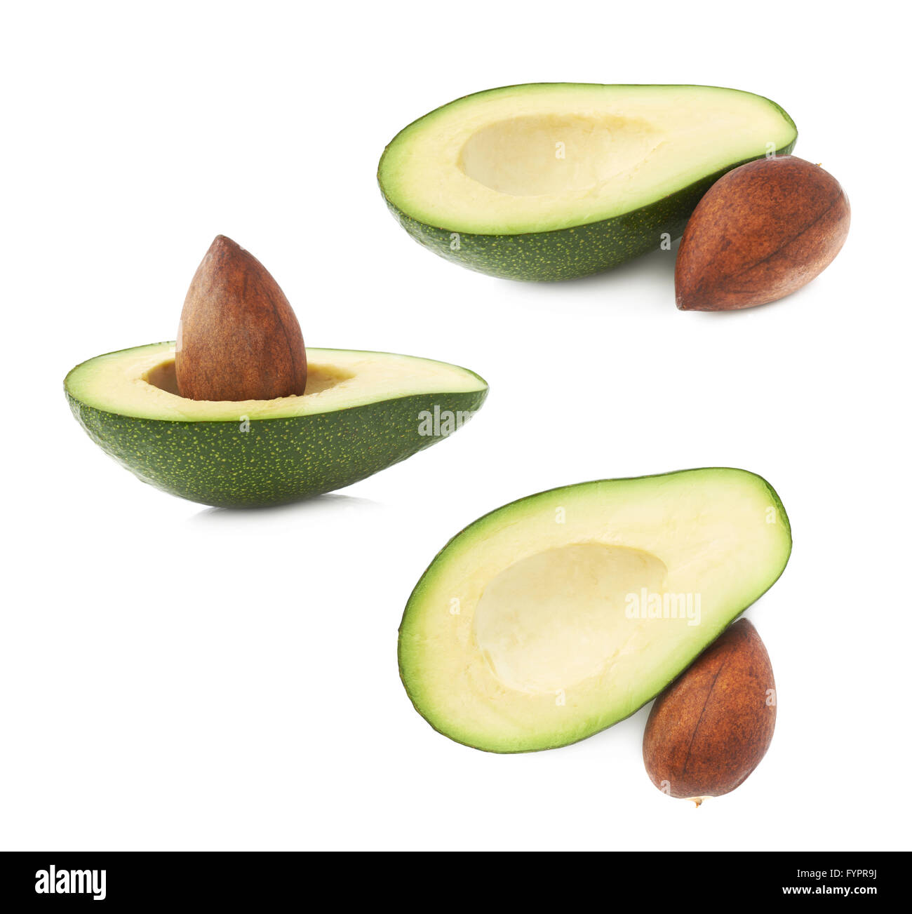 Avocado's half and pit isolated Stock Photo - Alamy