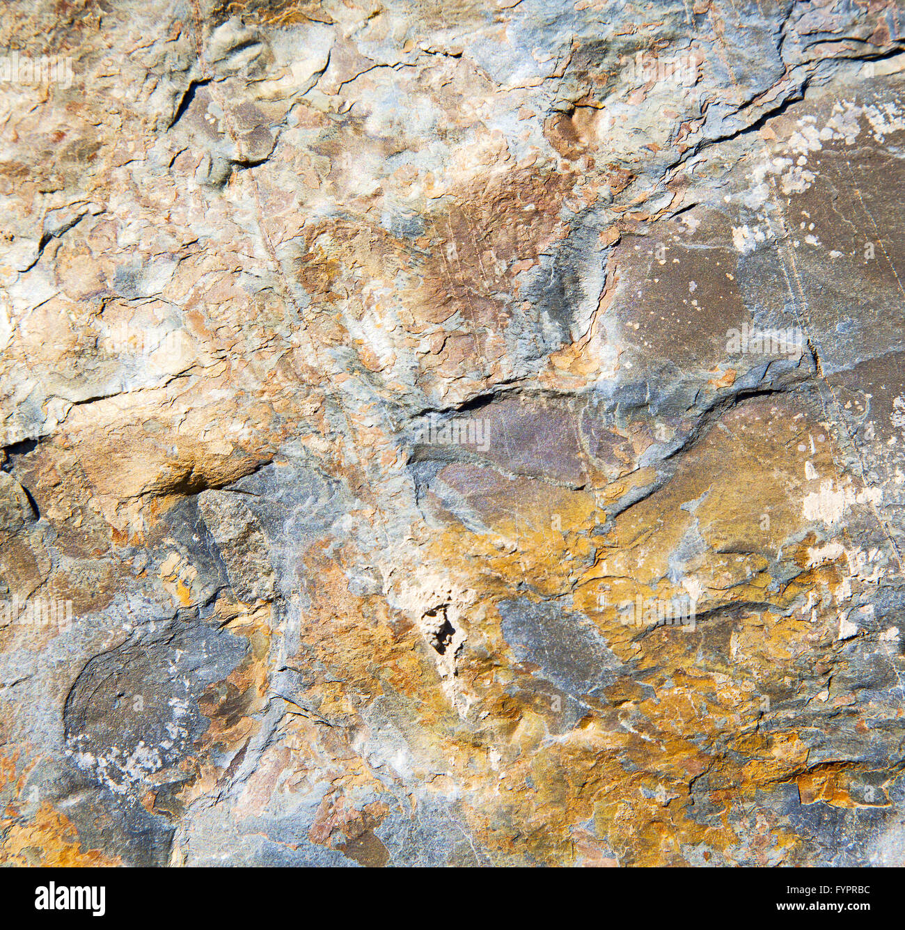 rocks stone and red orange gneiss in the wall of morocco Stock Photo ...