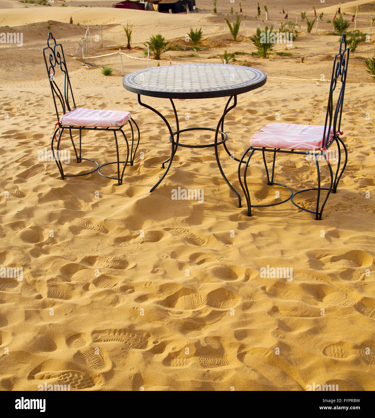 table and seat in desert sahara morocco africa yellow sand Stock Photo ...