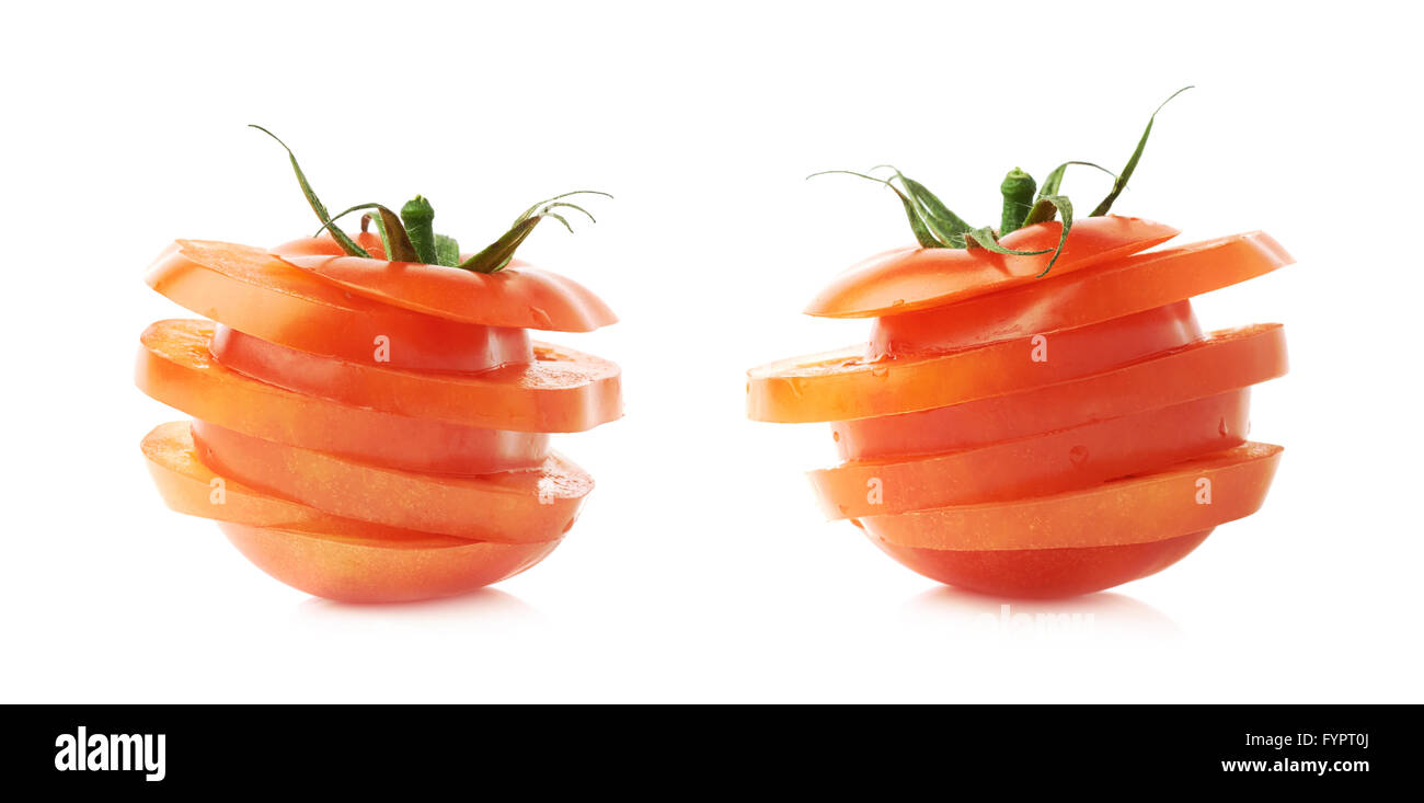 Tomato cut in slices isolated Stock Photo - Alamy