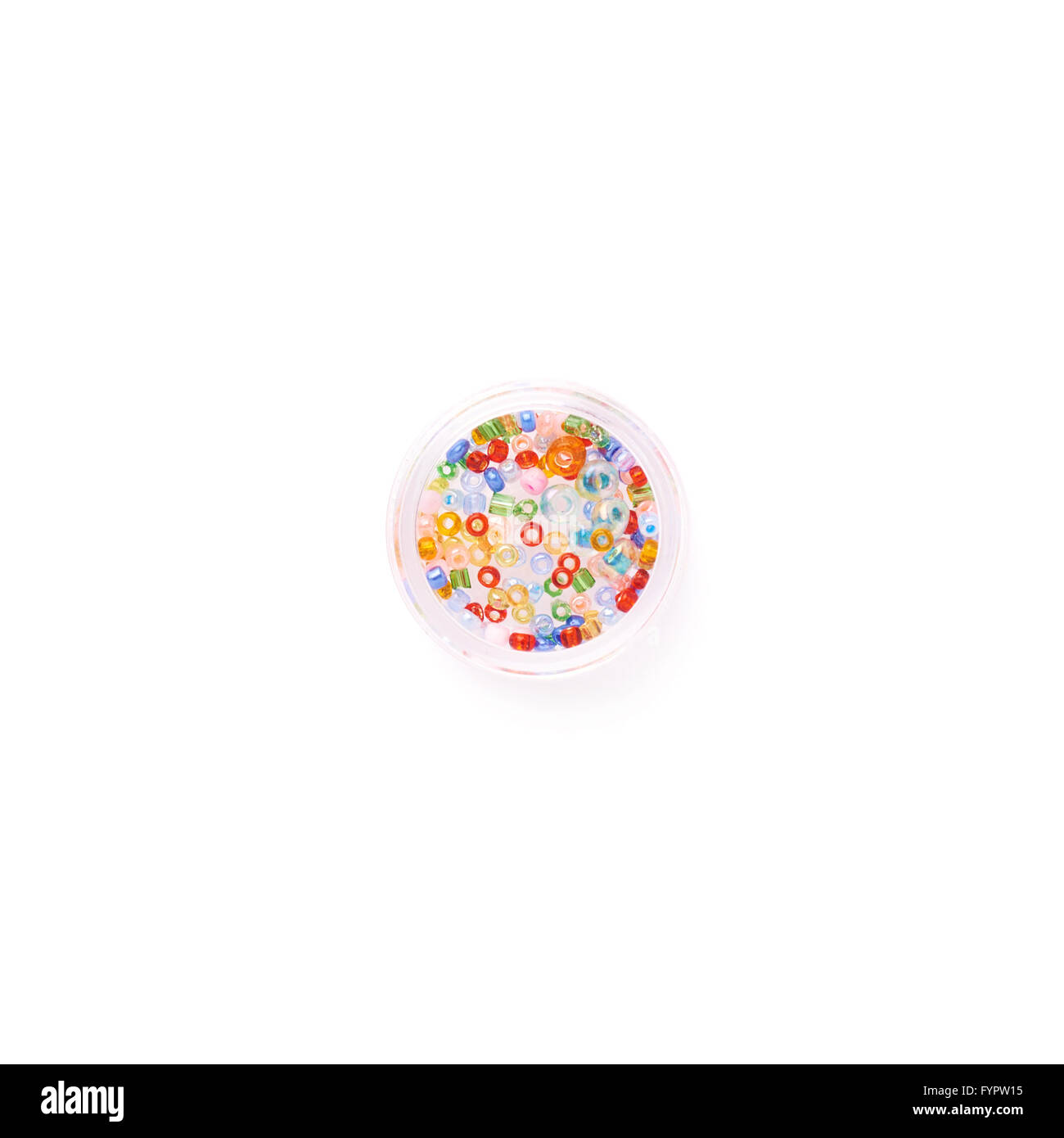 Beads in round box over white isolated background Stock Photo - Alamy