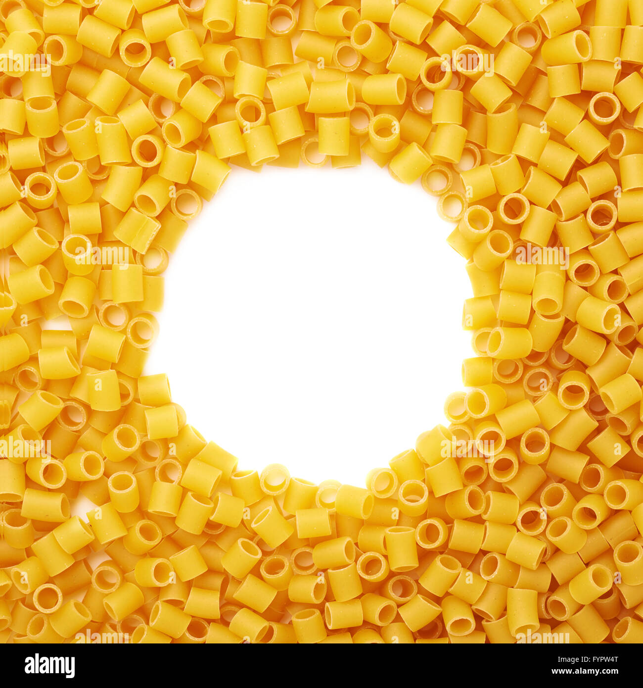Round frame made of dry ditalini pasta over isolated white background ...