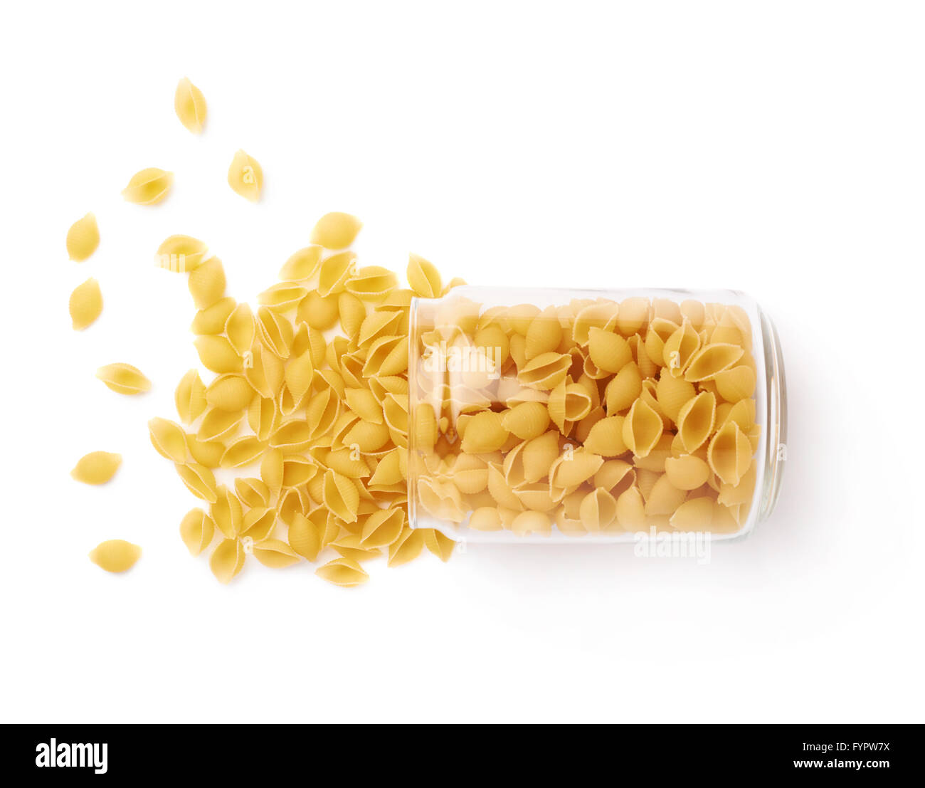 Glass jar filled with dry conchiglie pasta over isolated white ...