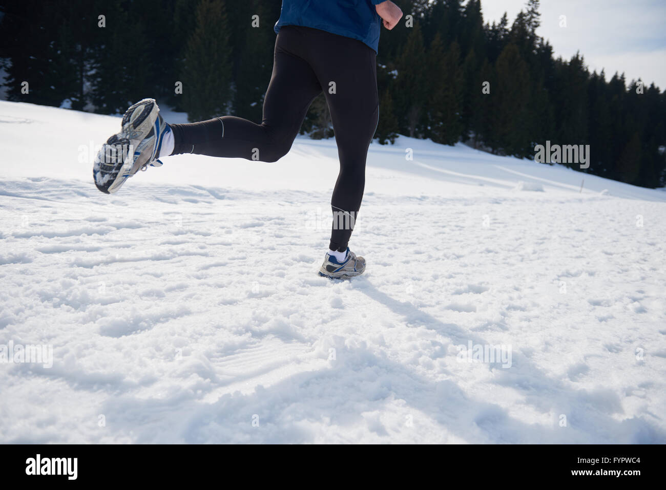 jogging on snow in forest Stock Photo - Alamy