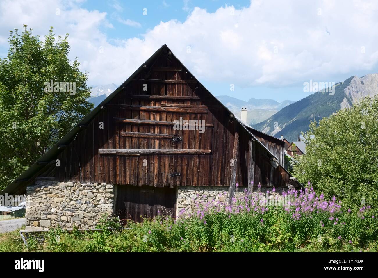 Old ramshackle barn made of boulders and wood, situated in Albiez ...