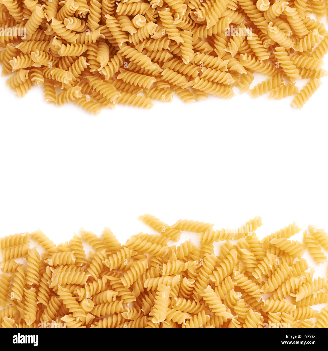 Pile of dry rotini pasta over isolated white background Stock Photo - Alamy