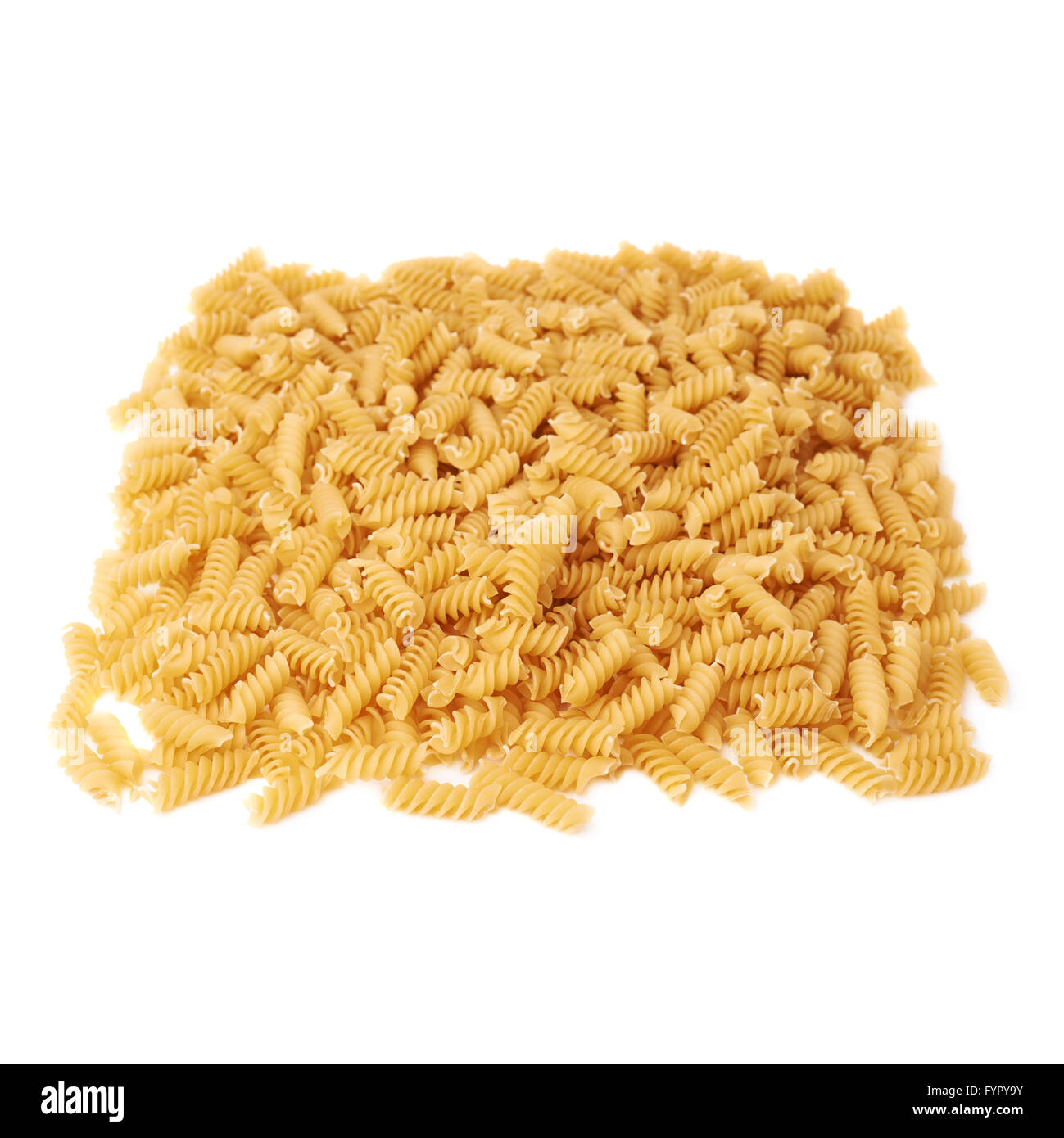 Pile of dry rotini pasta over isolated white background Stock Photo - Alamy
