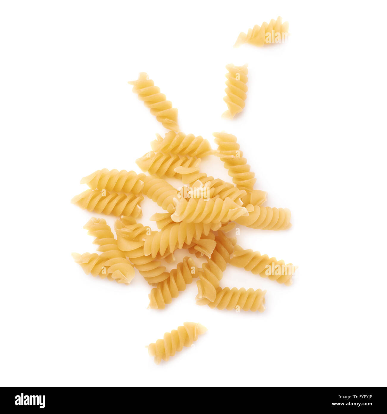 Pile of dry pasta rotini over isolated white background Stock Photo - Alamy