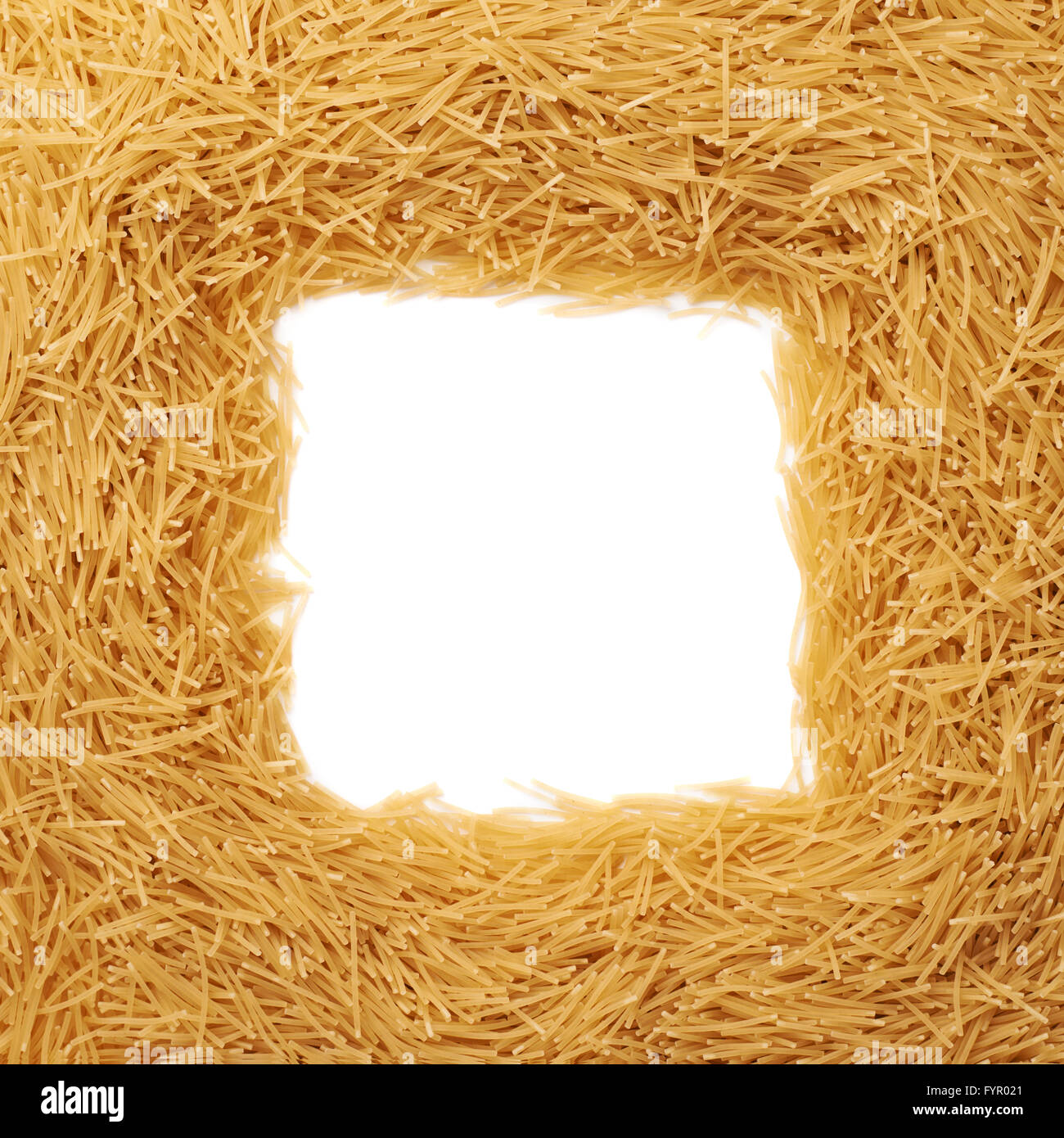 Square frame made of dry noodles pasta over isolated white background ...
