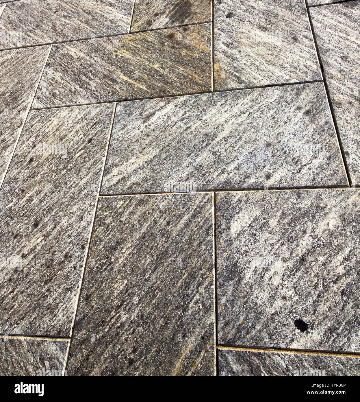 near mozzate street lombardy i pavement of a curch and wall marble ...