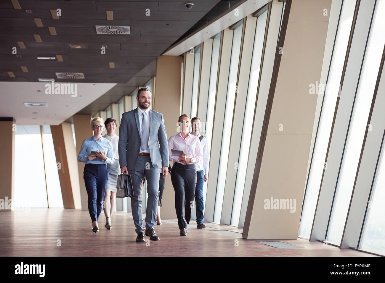 business people group walking Stock Photo - Alamy