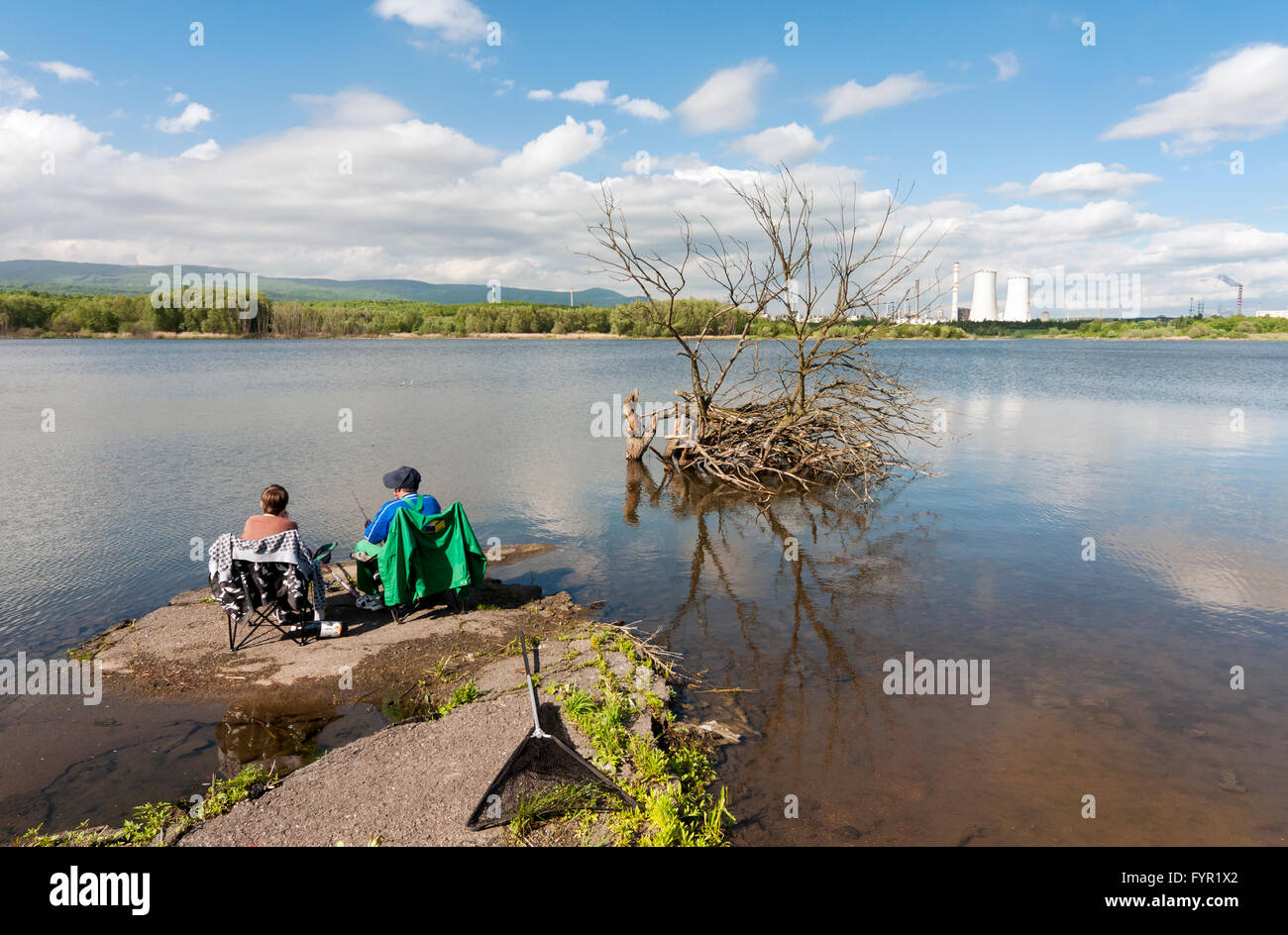 Fishing in a lake at the site of a former surface mine, post-mining ...