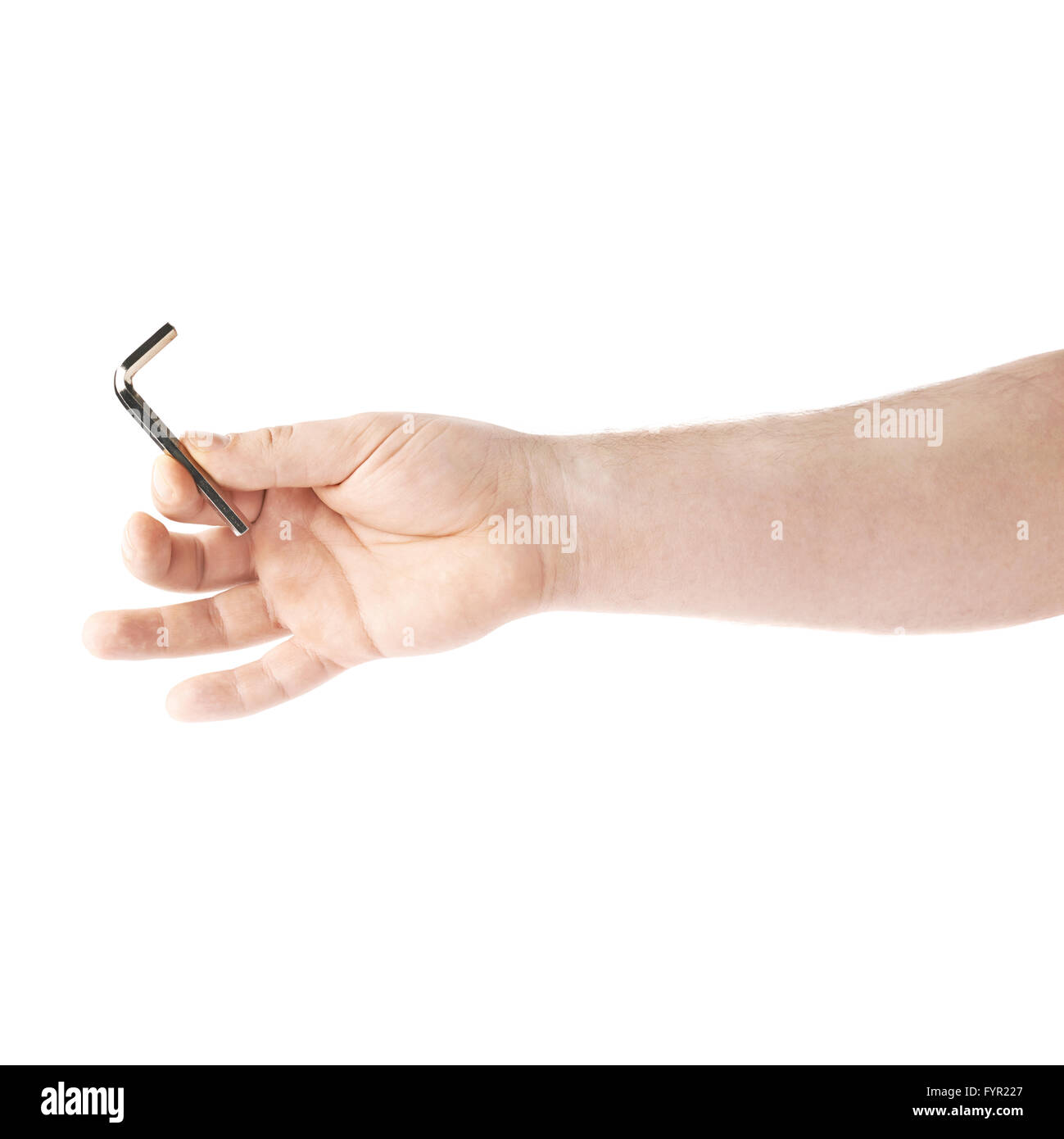 Hand holding a hex metal allen L key tool, composition isolated over ...
