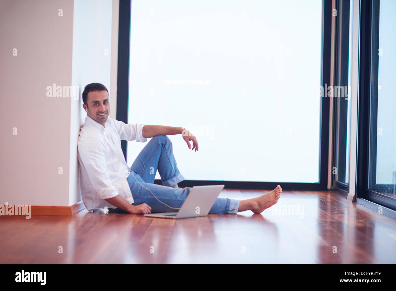 working on laptop computer from home Stock Photo - Alamy