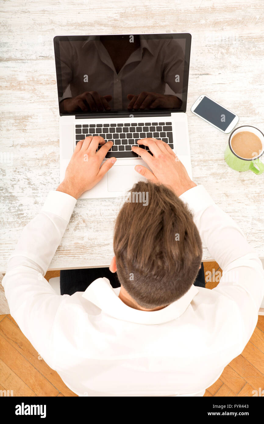 Young man with a laptop computer Stock Photo - Alamy