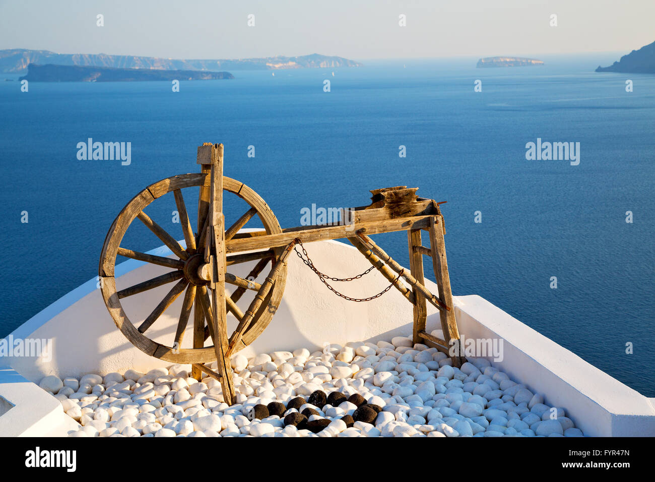 greece in santorini sea and spinning wheel Stock Photo - Alamy