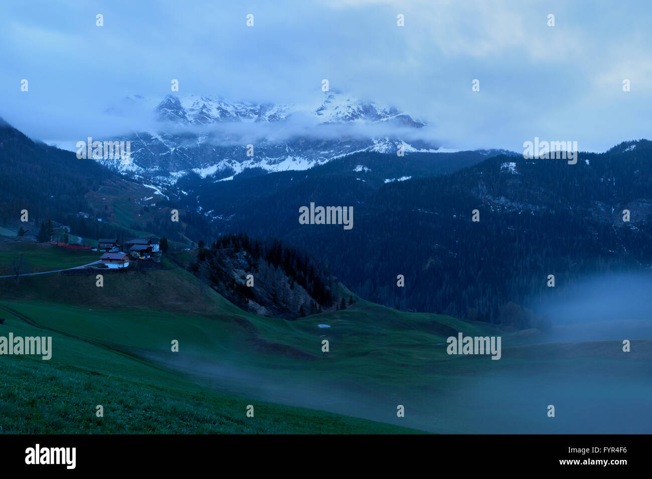 Foggy sunrise over Dolomites mountains Stock Photo - Alamy