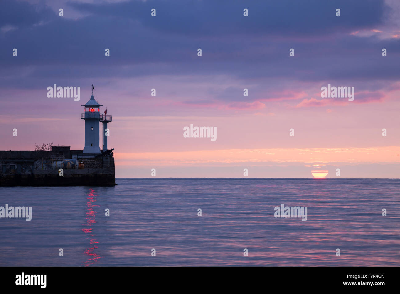 Lighthouse on sunrise Stock Photo - Alamy