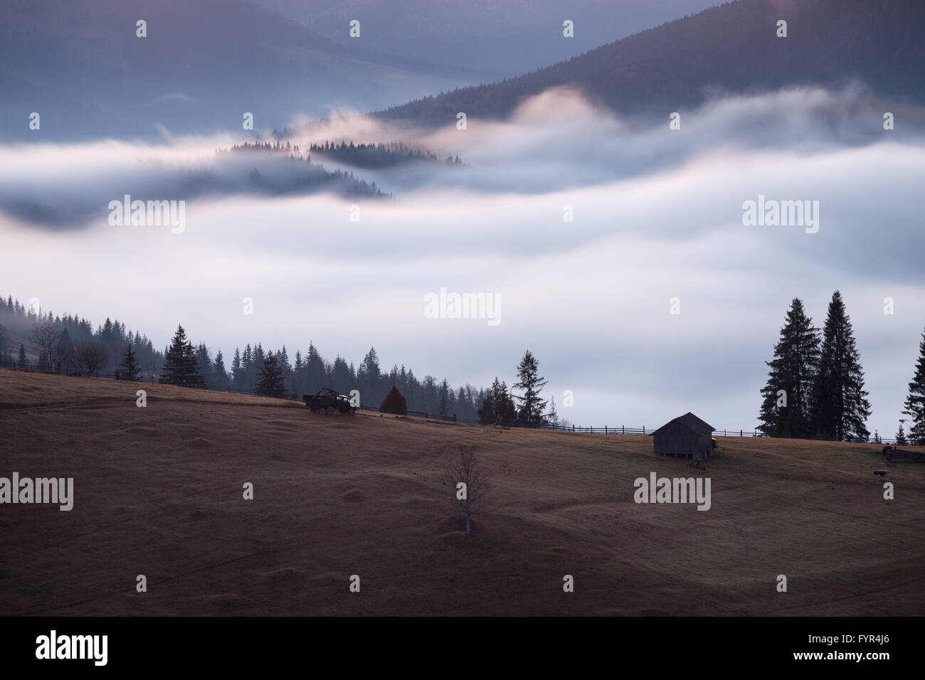 Mountains rural landscape at foggy sunrise Stock Photo - Alamy