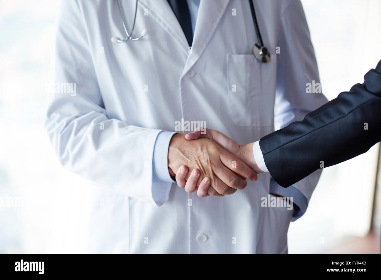 doctor handshake with a patient Stock Photo - Alamy