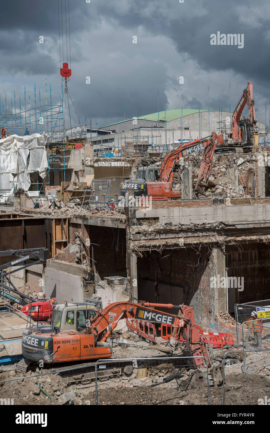 Diggers from the McGee Group get stuck into the demolition of the Shell ...