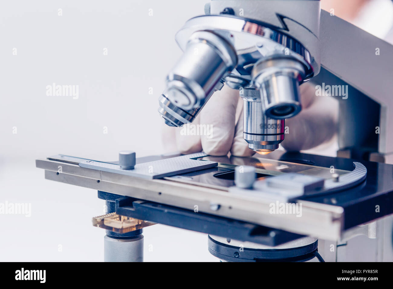 Scientist hands with microscope Stock Photo - Alamy