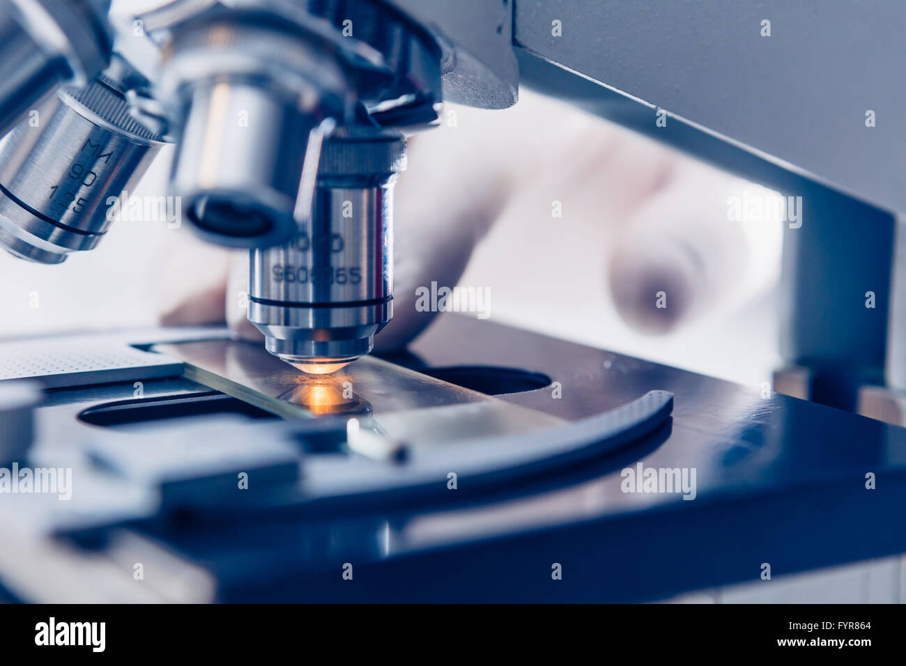 Scientist hands with microscope Stock Photo - Alamy