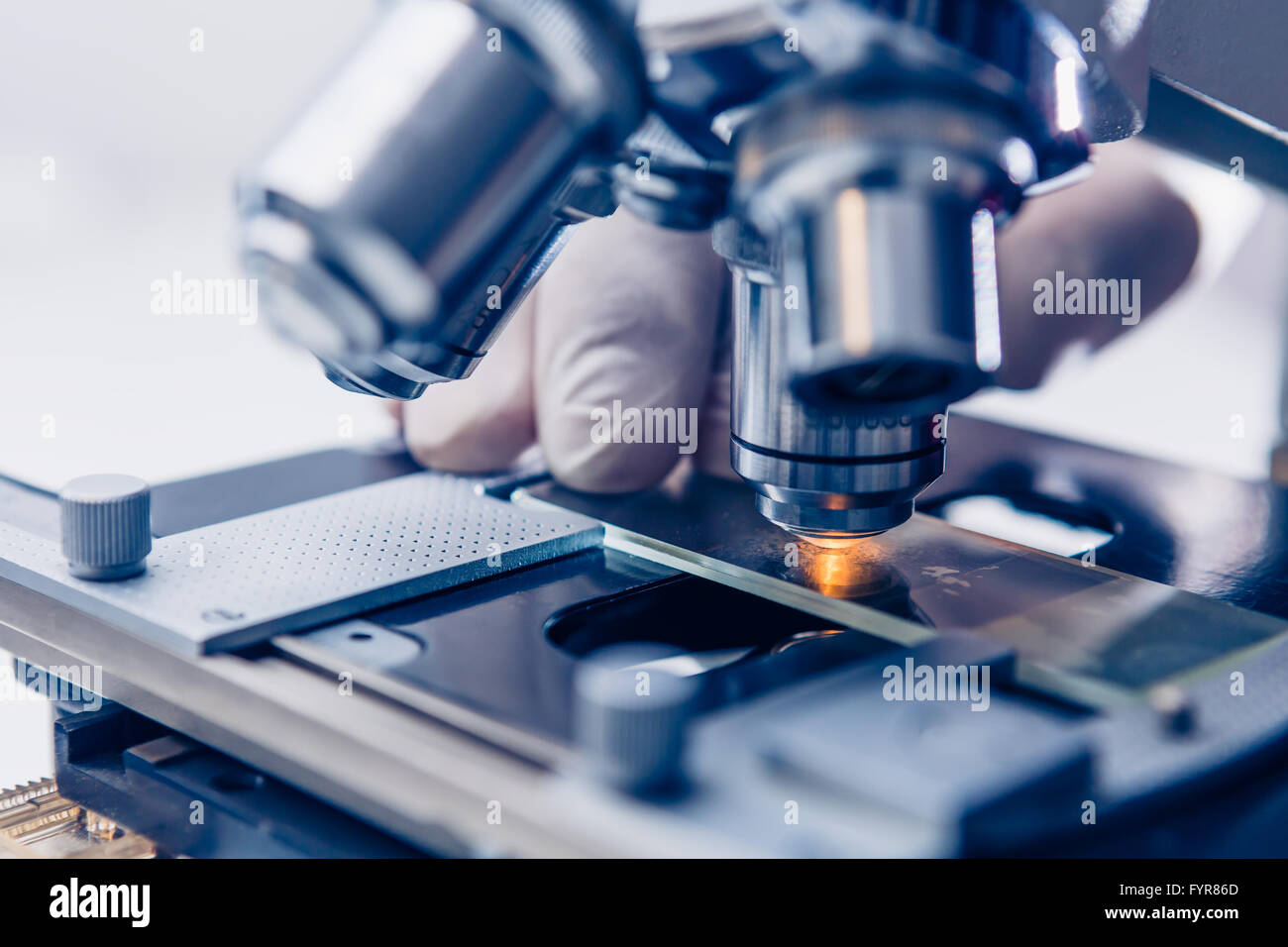 Scientist hands with microscope Stock Photo - Alamy