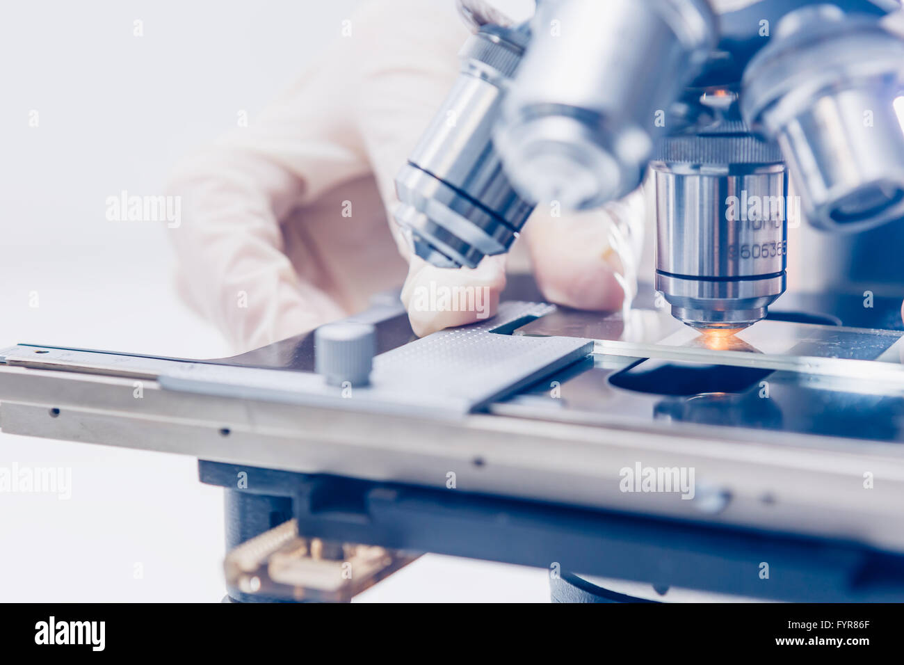 Scientist hands with microscope Stock Photo - Alamy