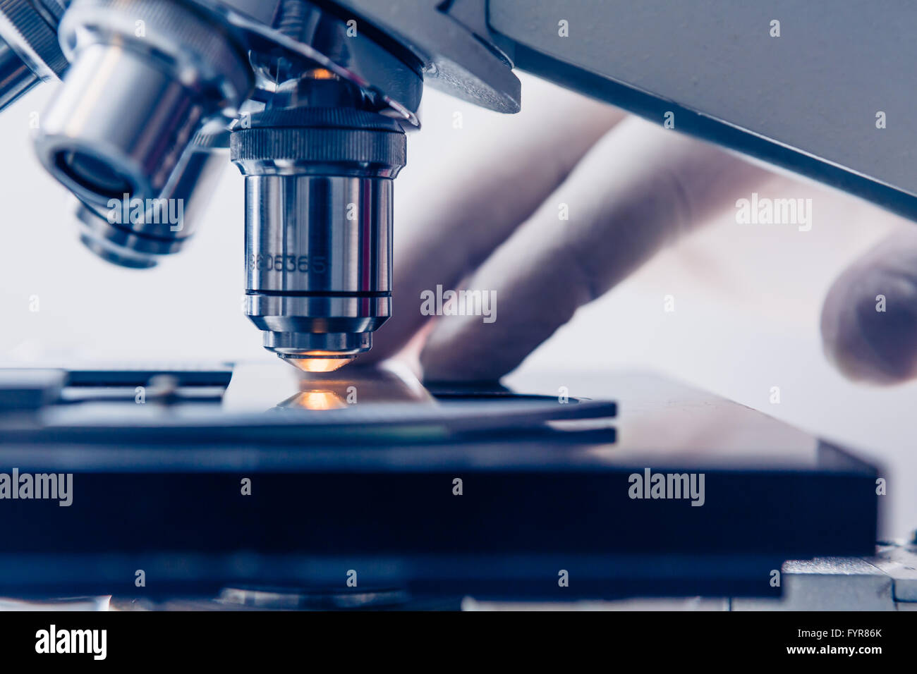 Scientist hands with microscope Stock Photo - Alamy