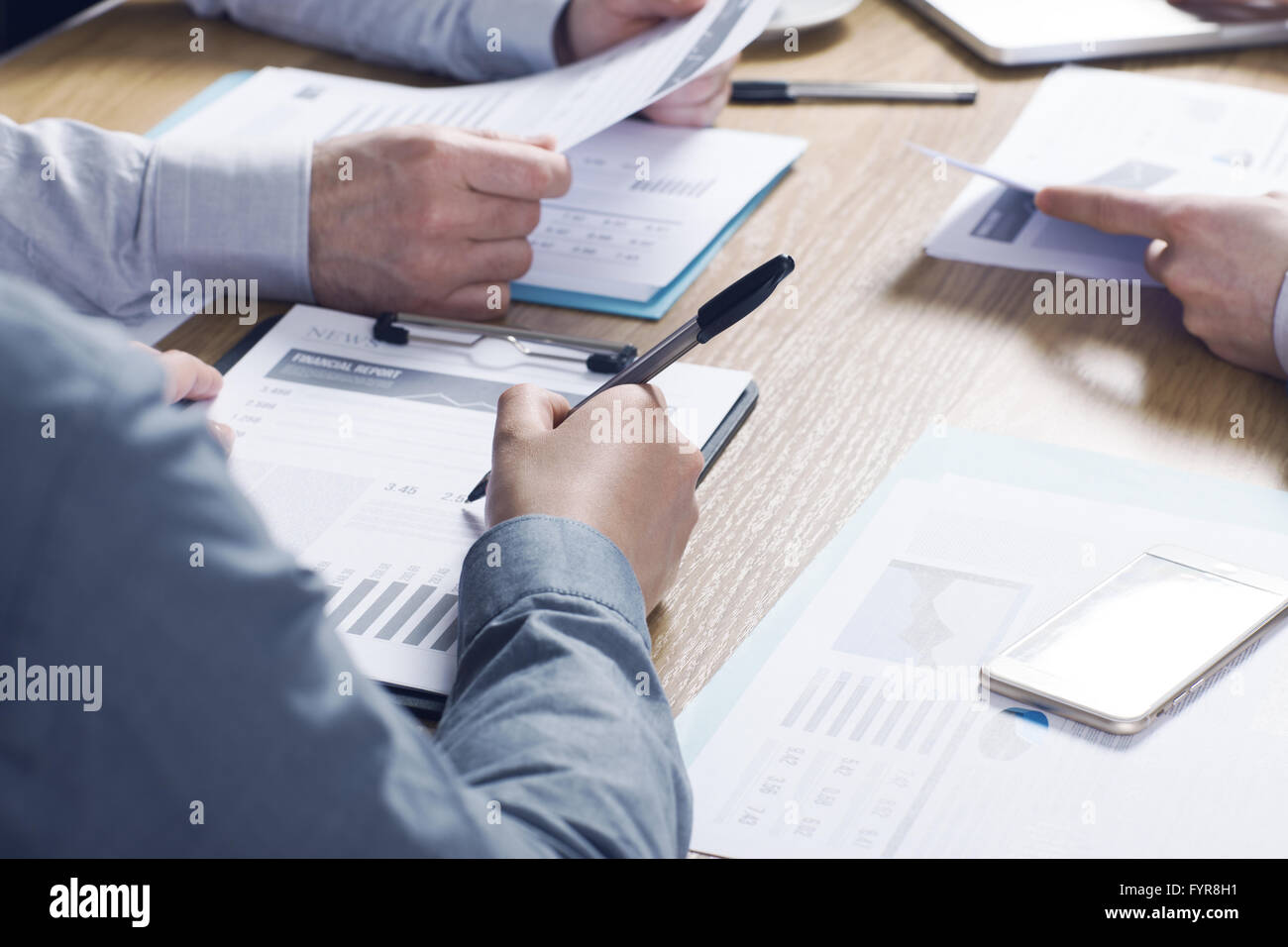 Business people team working together at office desk with financial ...