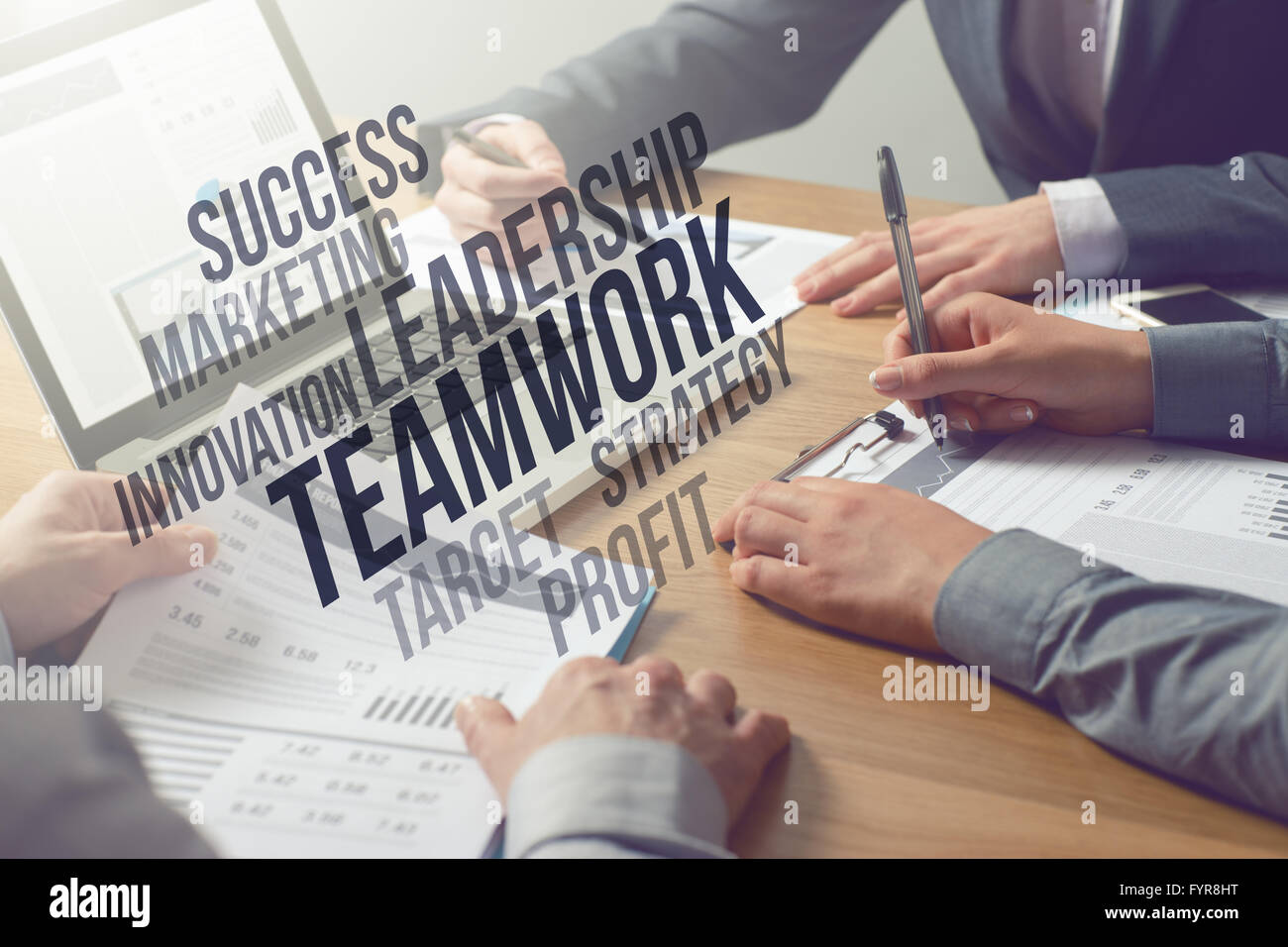 Business professionals working together at office desk, teamwork and ...