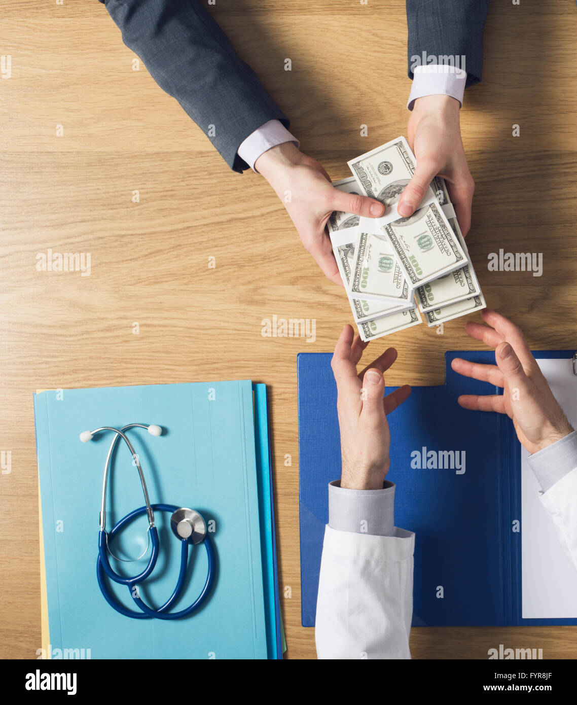 Male patient having a medical visit and bribing a greedy doctor with a ...