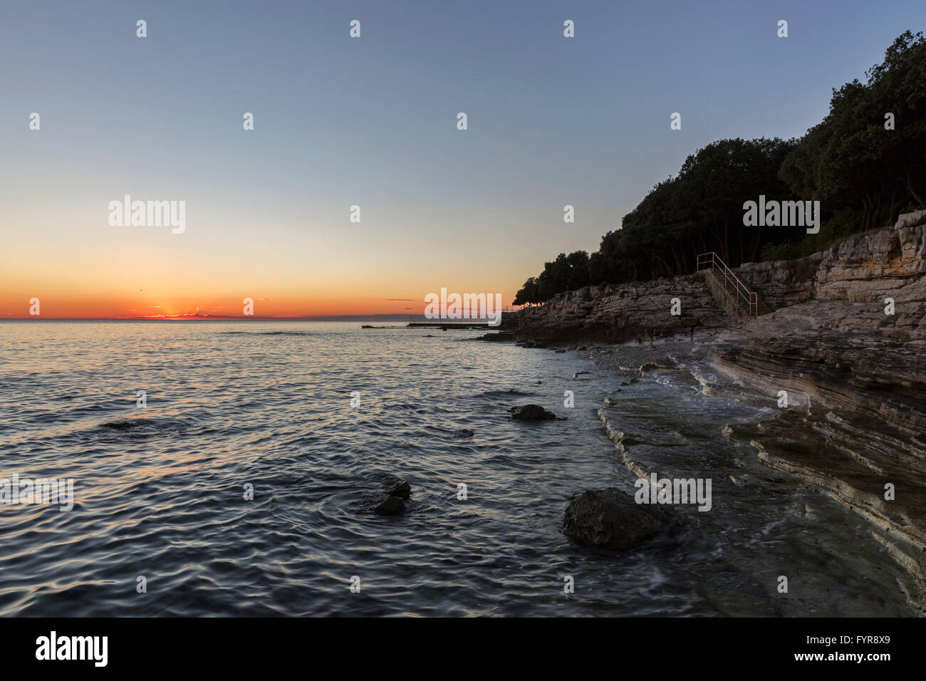 Sunset rocky beach in Istra, Croatia. Solaris summer resort, Adriatic ...