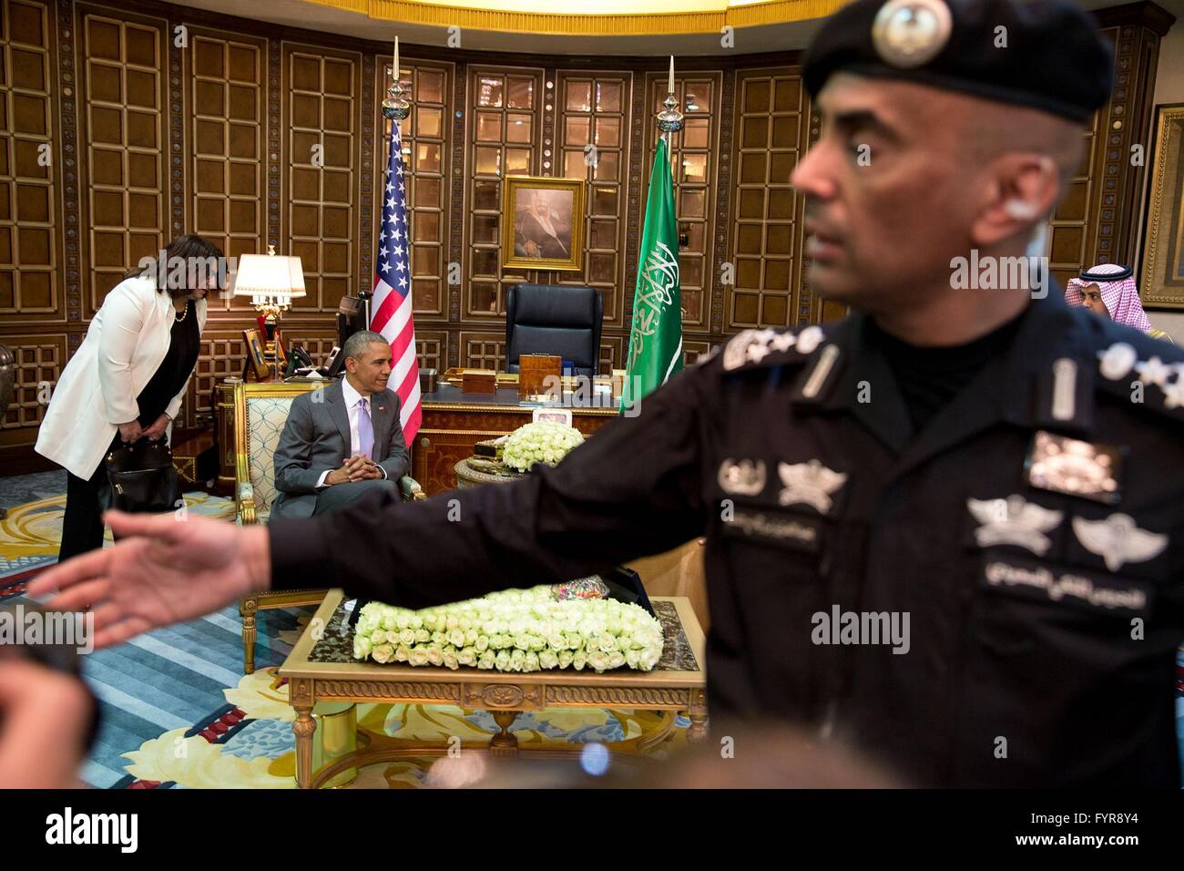 A royal guard blocks the view of cameras as U.S President Barack Obama ...