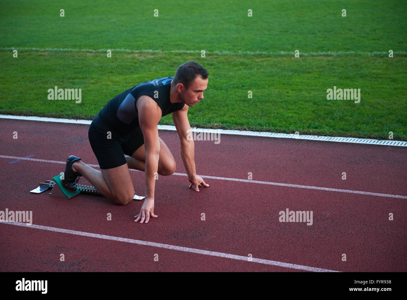 Athletic man start Stock Photo - Alamy