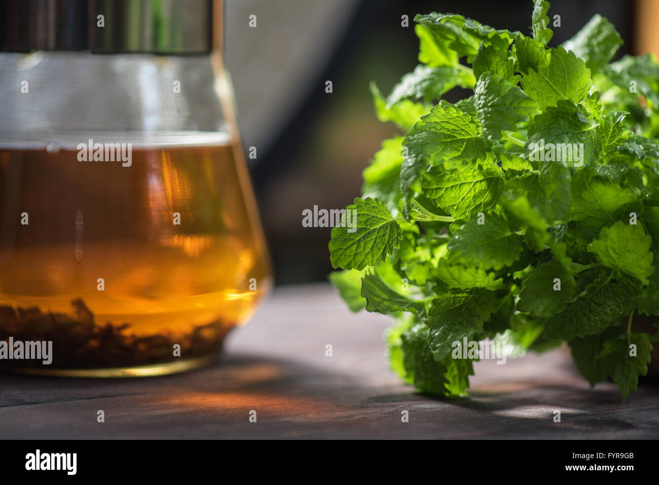 Tea with green fresh melissa Stock Photo - Alamy